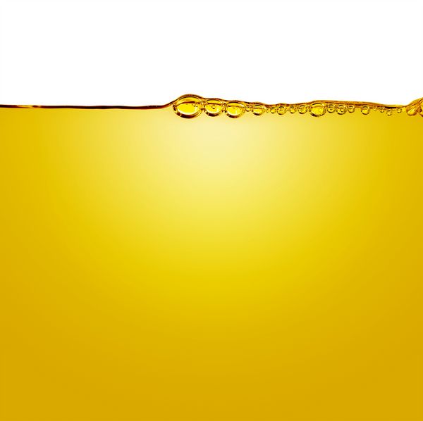 ریختن رنگ زرد نفت و حباب در سفید پس زمینه 1335061